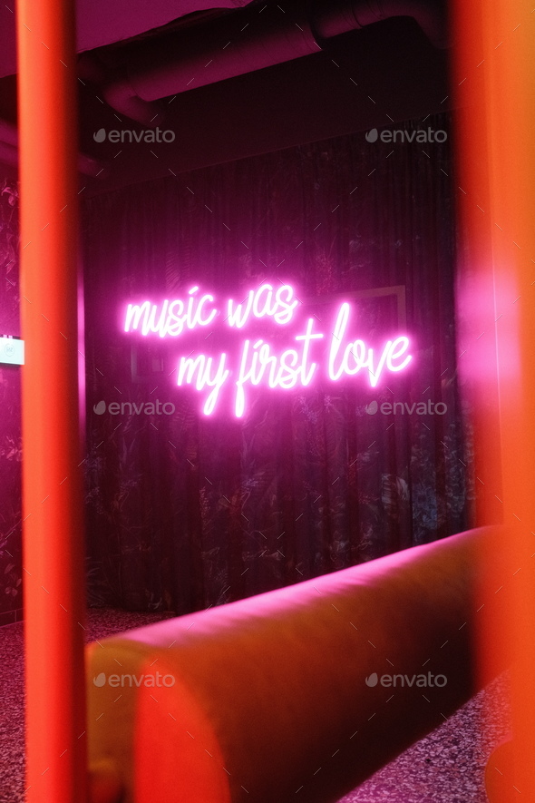 Vertical beautiful pink neon text sigh on a wall in dark Stock Photo by ...