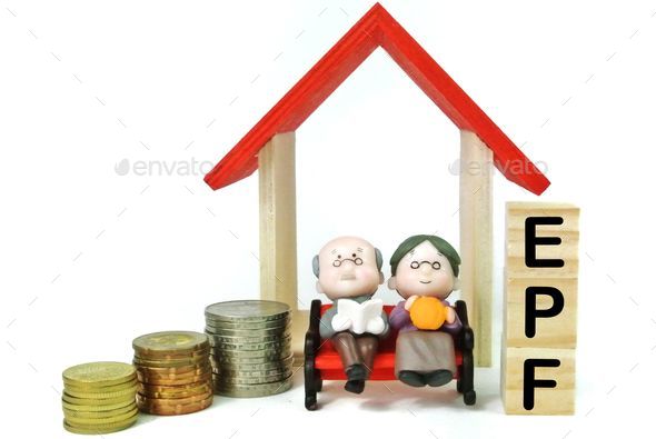 Wooden block with the word EPF with different coins, a fake house and ...