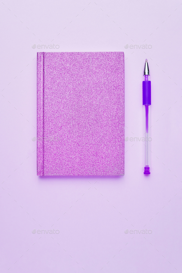 Pink notepad with pen on pastel pink backdrop on neon light. Back to ...