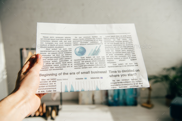 cropped view of man holding business newspaper in hand Stock Photo by ...