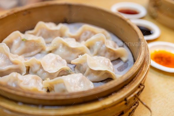 Traditional steamed meat dumpling basket Stock Photo by leungchopan