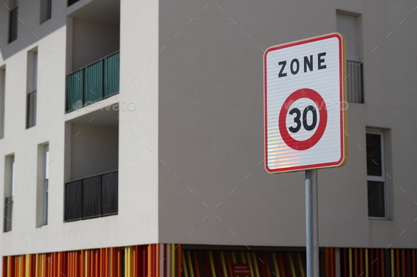 French road traffic sign indicating a zone limited to 30 behind a ...