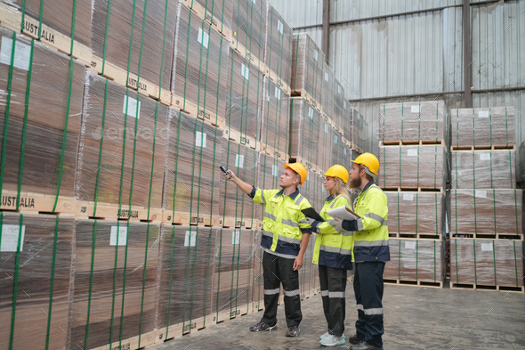 Woman with checklist in a timber and lumber warehouse. Product ...