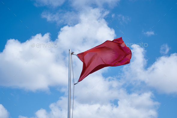 Red flag waving in the wind Stock Photo by wirestock | PhotoDune