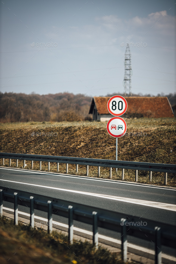 Vertical shot of two road signs Stock Photo by wirestock | PhotoDune