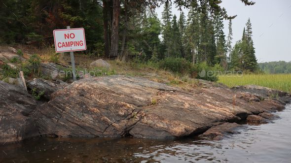 No camping sign on the shore of Caddy Lake, Manitoba, Whiteshell ...