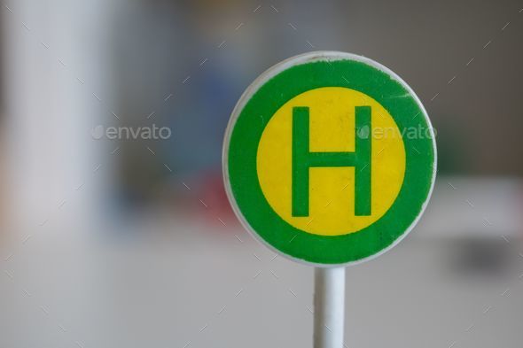 Yellow and green bus stop sign for kids Stock Photo by wirestock ...