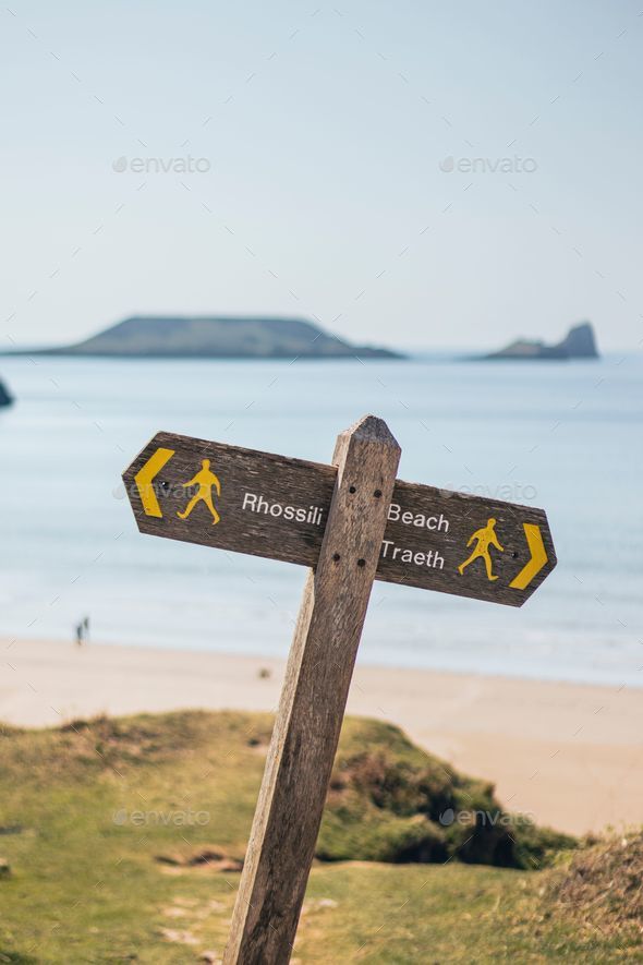 Vertical view of beach information panels- Rhossili village and Traeth ...
