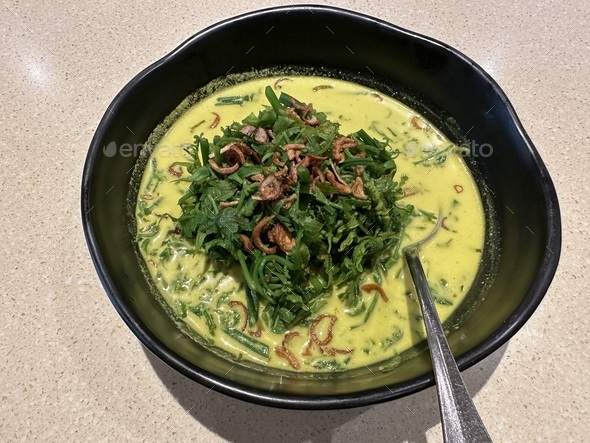 Young jungle fern cooked in coconut milk, a Malaysian cuisine Stock ...