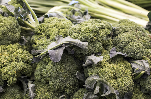 Pile of green broccoli at the farmers market Stock Photo by esindeniz