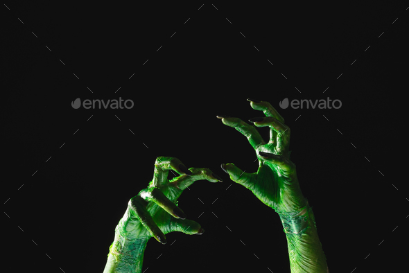 Green monster hands with black nails reaching on black background Stock ...