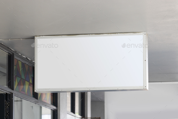 Blank sign hanging from building ceiling with copy space Stock Photo by ...