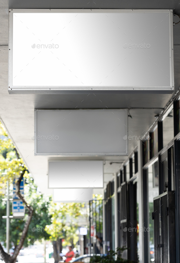 Blank signs hanging from building ceiling with copy space Stock Photo ...