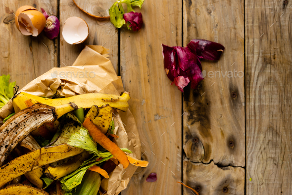 Overhead of organic fruit and vegetable food waste spilling from full ...