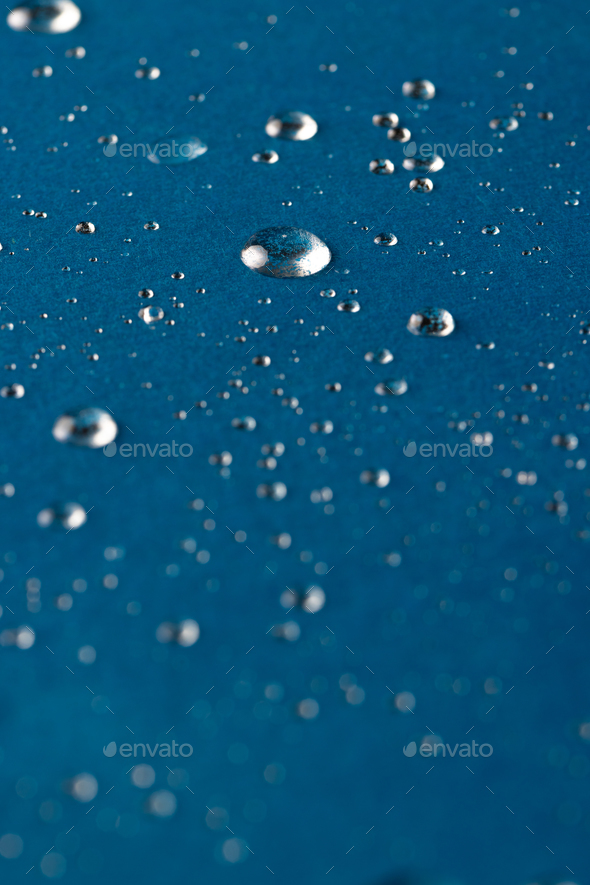 Micro close up of water drops with copy space on blue background Stock ...