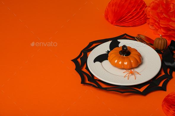 Table setting for Halloween, decorations with spiders and pumpkins ...