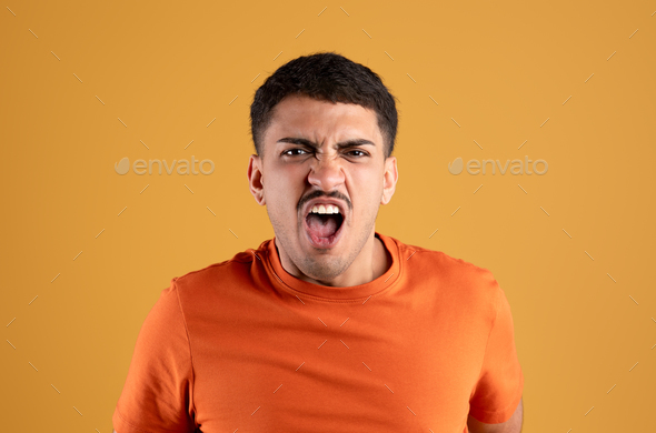 Human reactions concept. Angry brazilian man shouting, screaming loud ...