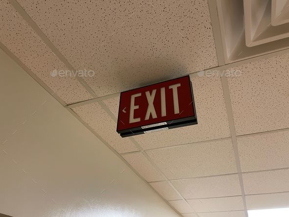Vintage interior school renovated exit sign Stock Photo by wirestock