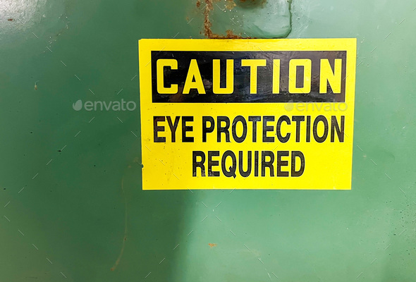 Caution eye protection yellow-colored sign with green background Stock ...