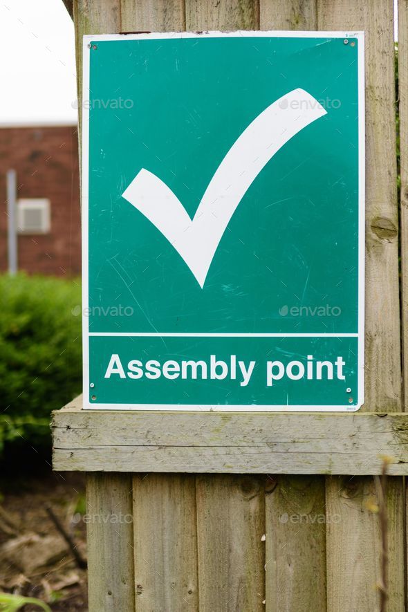 Assembly point sign outside Stock Photo by wirestock | PhotoDune