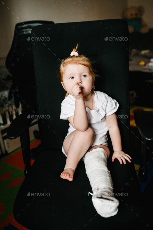 Child with bandage on leg heel fracture. Broken left foot, bone, calf ...