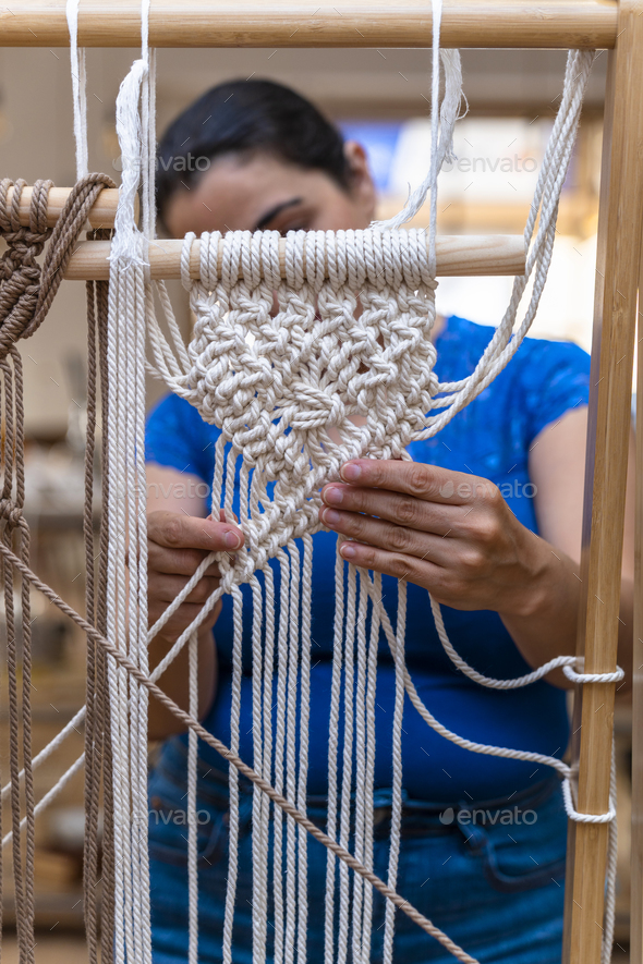 The art of tying knots. Women making professional macrame in an embroidery workshop. Stock Photo ...