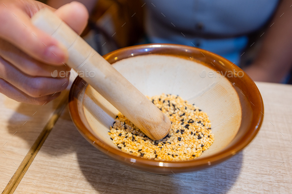 Sesame grind bowl with wooden stick Stock Photo by leungchopan | PhotoDune