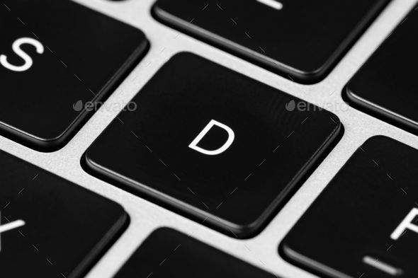 Closeup shot of a grey keyboard layout with black keys and white font ...