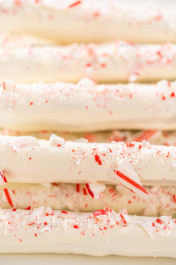 Candy cane chocolate covered pretzel rods Stock Photo by arina-habich