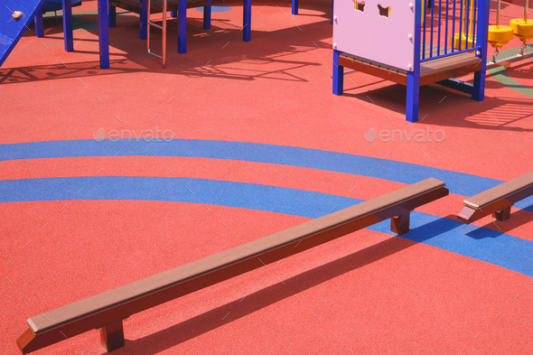 Balance beams with playground equipment on colorful rubber floor in ...