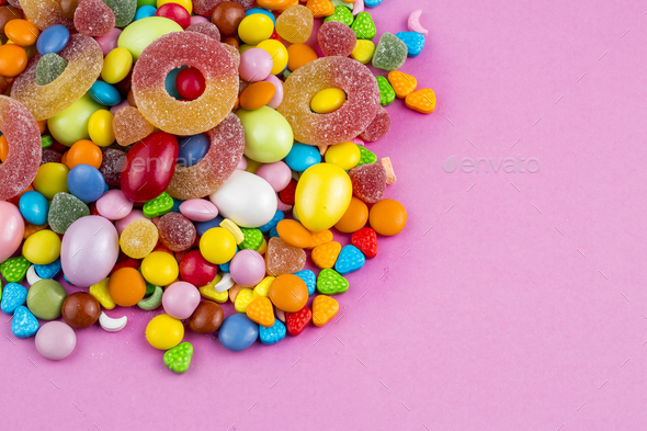 Colorful lollipops and different colored round candy. Top view. Stock ...