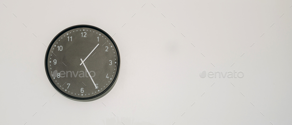 Black clock at white wall background texture with copy space. Stock ...