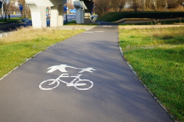 High angle shot of road signs on the ground for cyclists and ...