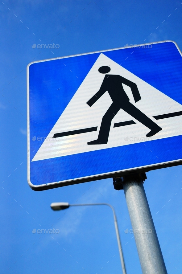 Low angle shot of a blue zebra crossing traffic sign Stock Photo by ...