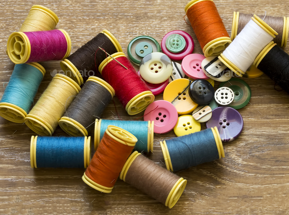 Tailor materials; colored spool rope and buttons Stock Photo by esindeniz