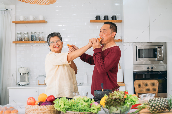 Happy Vacation Time: Elderly Couple Cooking Together in the Kitchen ...
