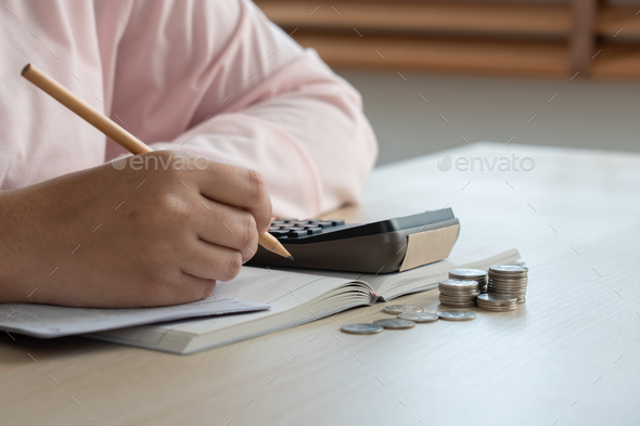 Woman doing home accounting calculating book bank statement for ...