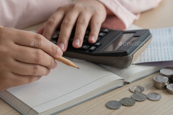 Woman doing home accounting calculating book bank statement for ...