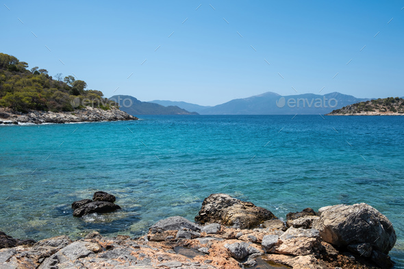Greece Aponisos beach Agistri island. Rocky land, pine tree, clear sea ...