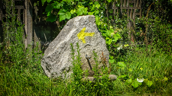Arrow on a stone indicating to pilgrims the direction to walk in Saint ...
