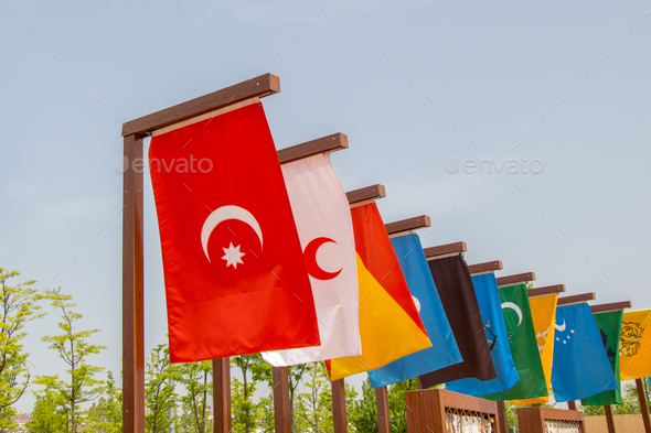 Closeup of different flags of Islamic countries on flagpoles under a ...