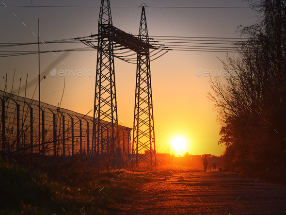Electrical power tower and lines on a sunset background Stock Photo by ...