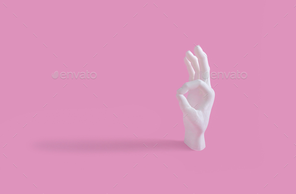 Human hand showing accepting okay hand sign gesture on pastel pink ...