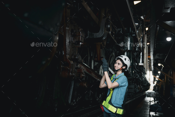 Engineer are working in the factory. Worker helping to repair and ...