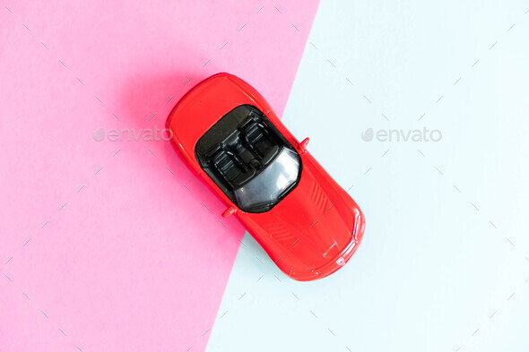 Retro toy car detail. Red toy car with an open top on a white ...