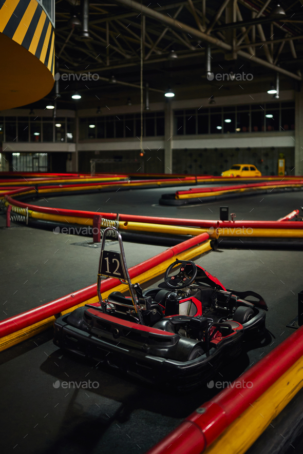 design of racing car inside of indoor kart circuit, red motor race ...