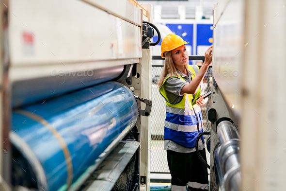 Industrial factory workers working in metal manufacturing industry ...
