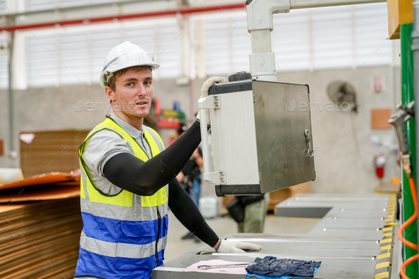 Industrial factory workers working in metal manufacturing industry ...