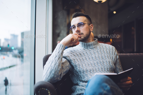 Focused man enjoying reading book Stock Photo by GaudiLab | PhotoDune