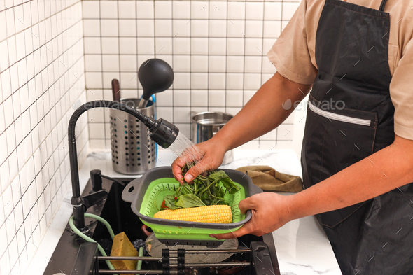 man washing vegetables Stock Photo by Garakta-Studio | PhotoDune